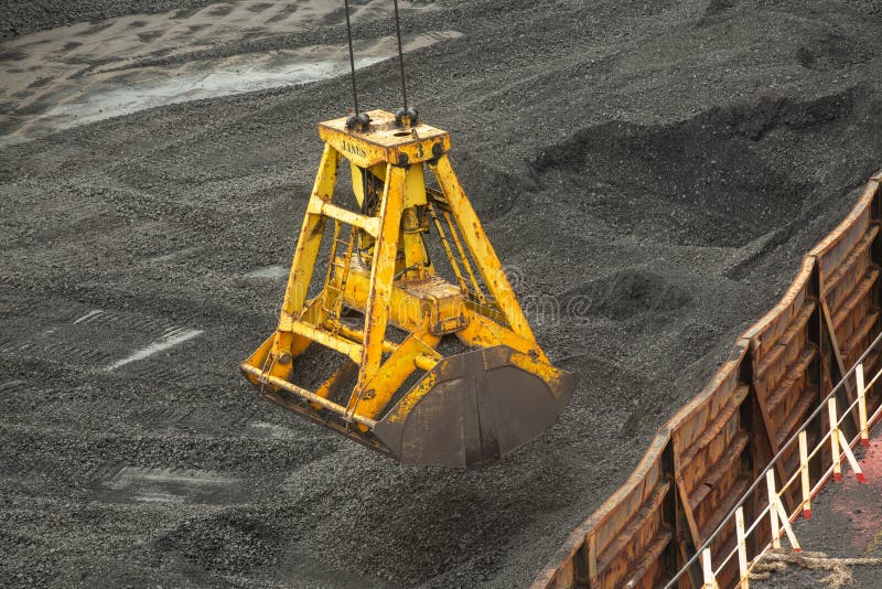 Loading Coal from Cargo Barges Onto a Bulk Vessel Using Ship Cranes in ...
