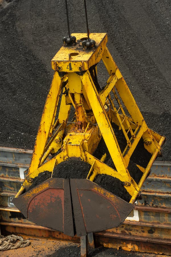 Loading Coal from Cargo Barges Onto a Bulk Vessel Using Ship Cranes in ...
