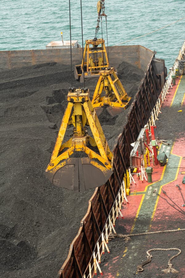 Loading Coal from Cargo Barges Onto a Bulk Vessel Using Ship Cranes in ...