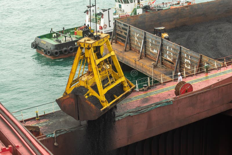 Loading Coal from Cargo Barges Onto a Bulk Vessel Using Ship Cranes in ...