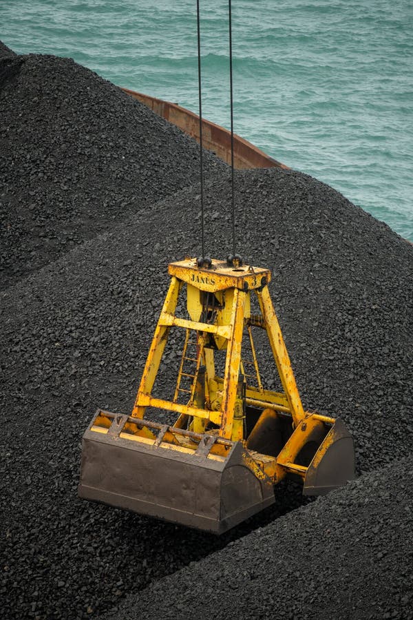 Loading Coal from Cargo Barges Onto a Bulk Vessel Using Ship Cranes in ...