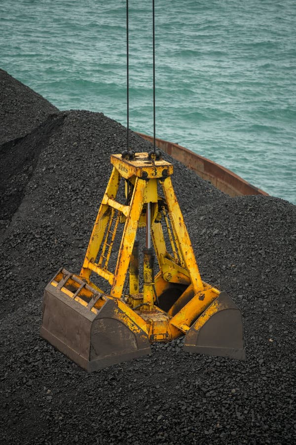 Loading Coal from Cargo Barges Onto a Bulk Vessel Using Ship Cranes in ...