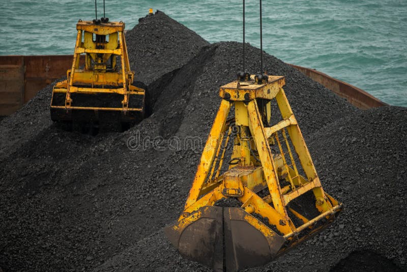 Loading Coal from Cargo Barges Onto a Bulk Vessel Using Ship Cranes in ...