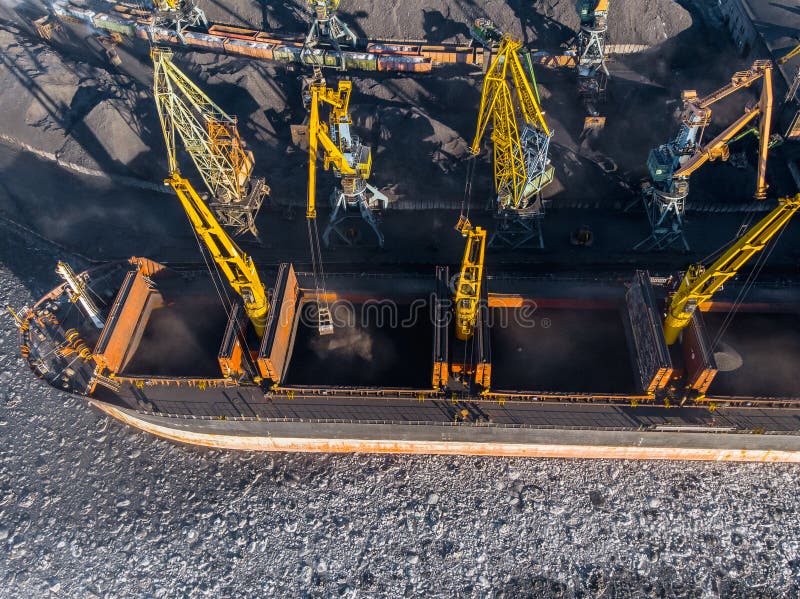 Loading Coal Mining in Port on Cargo Tanker Ship with Crane Bucket of ...