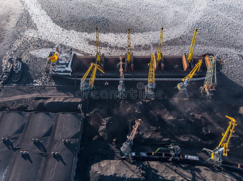 Loading Coal Mining in Port on Cargo Tanker Ship with Crane Bucket of ...