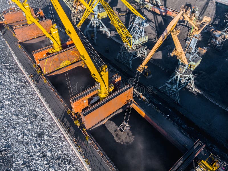 Loading Coal Mining in Port on Cargo Tanker Ship with Crane Bucket of ...