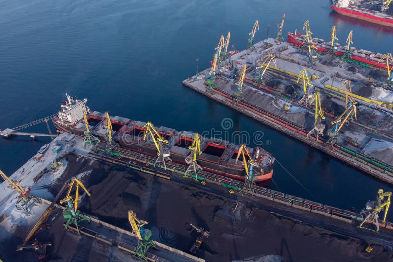 Loading Coal Mining in Port on Cargo Tanker Ship with Crane Bucket of ...