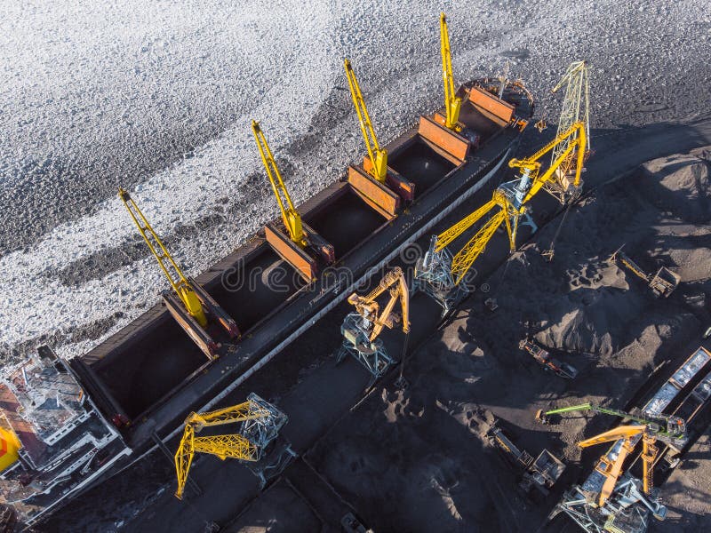 Loading Coal Mining in Port on Cargo Tanker Ship with Crane Bucket of ...