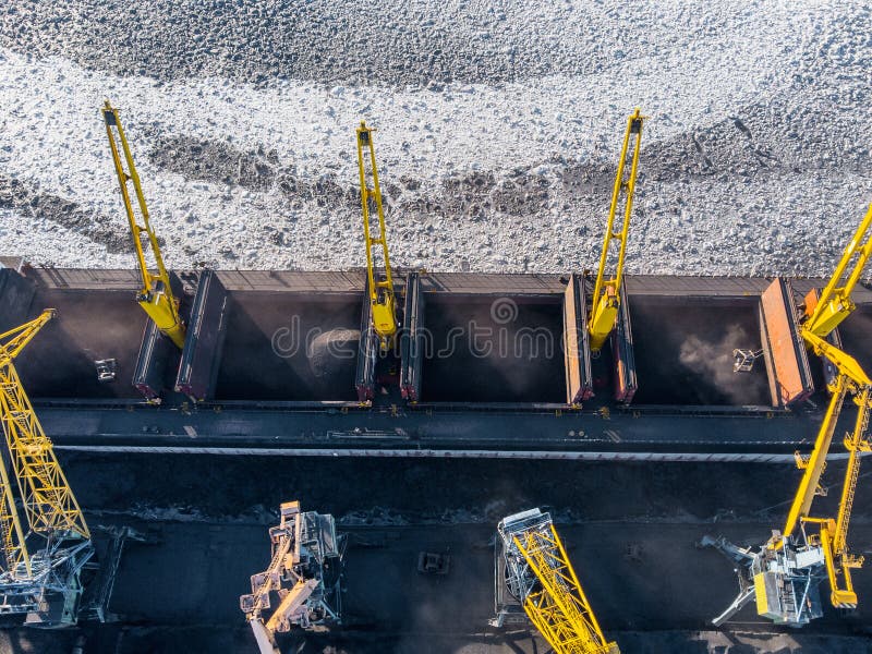 Loading Coal Mining in Port on Cargo Tanker Ship with Crane Bucket of ...
