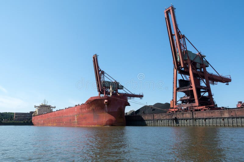 Loading Coal on an Old Transport Ship in the Port Stock Photo - Image ...