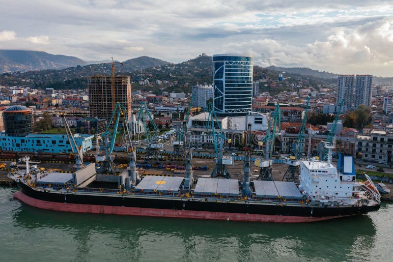 Loading of Containers into Cargo Ship in the Harbor Editorial Image ...