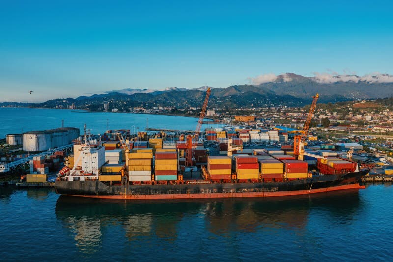 Loading of Containers into Cargo Ship in the Harbor Stock Photo - Image ...