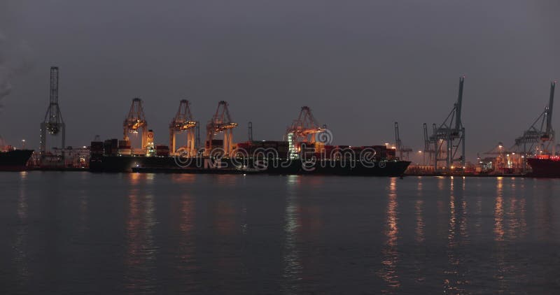 Loading Containers on a Cargo Ship at Night, Huge Container Ship Stock ...