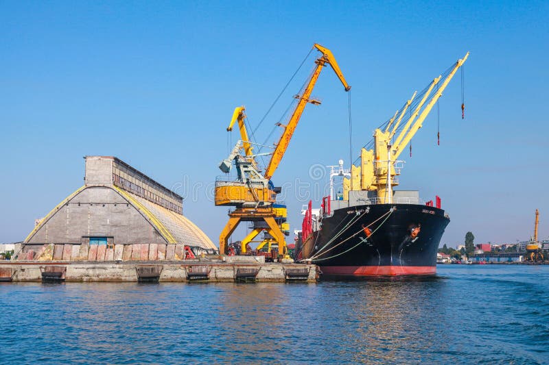 Loading with Cranes of Industrial Cargo Ship Stock Photo - Image of ...