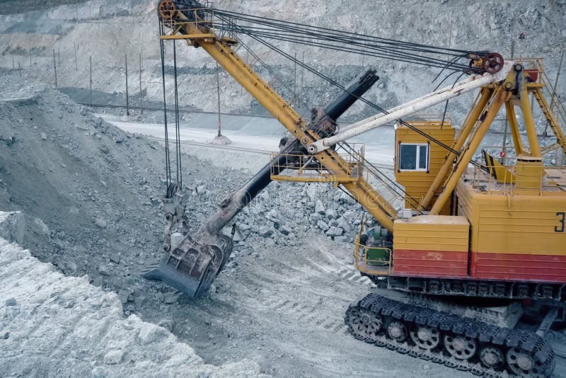 Loading of Crushed Stone into Trolleys Using an Excavator Stock Photo ...