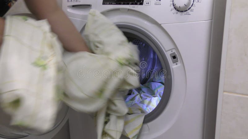 Loading Dirty Laundry into the Washing Machine. Stock Video - Video of ...