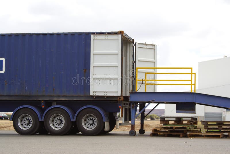 Semi Truck Sitting at a Loading Dock Stock Photo - Image of shipping ...