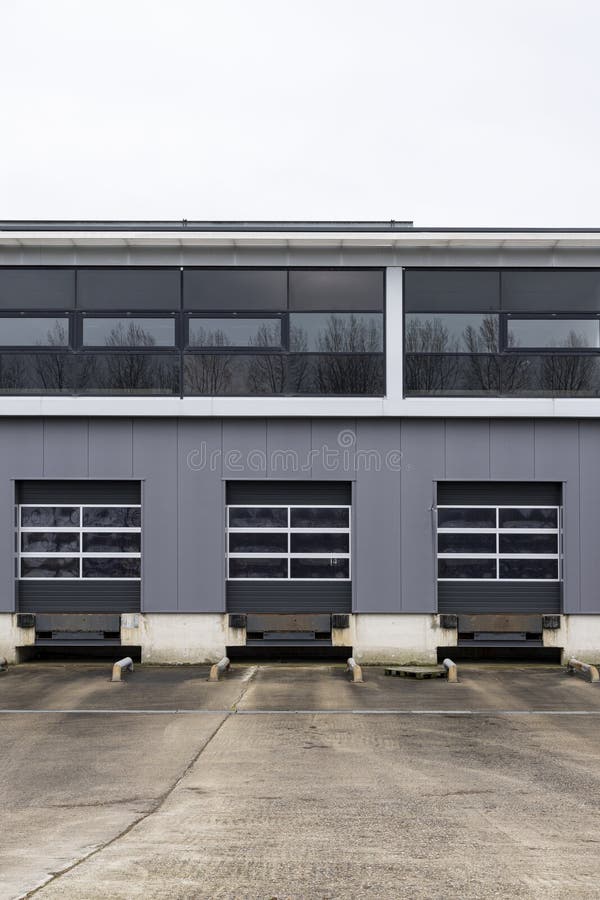 Loading docks of warehouse stock photo. Image of factory - 308212932
