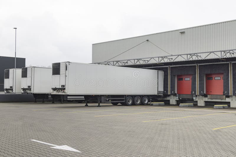 Loading docks of warehouse stock photo. Image of factory - 308212838