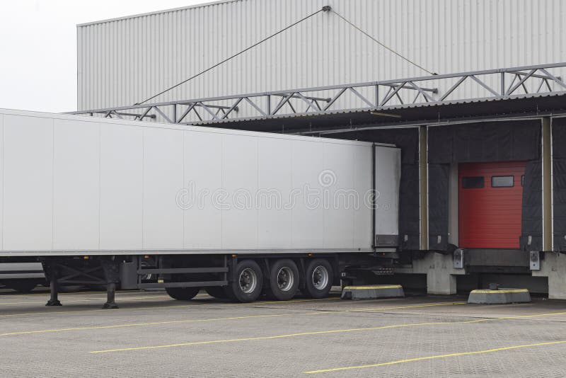 Loading docks of warehouse stock image. Image of loading - 308212857