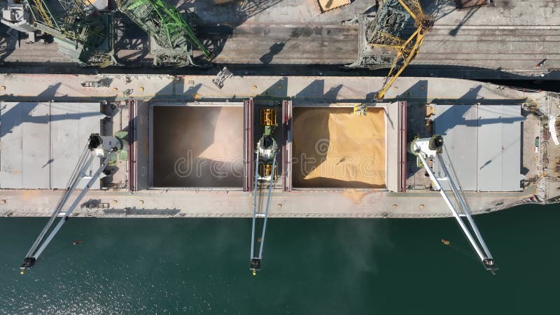 Loading Dry Cargo Ship of Wheat by Cranes in Port. Aerial View Loading ... Loading Dry Cargo Ship of Wheat by Cranes in Port. Aerial View Loading ...