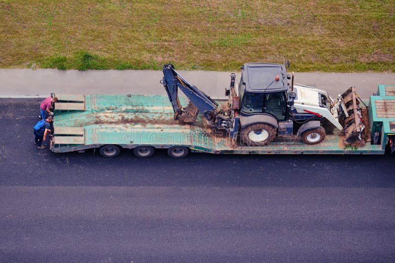 Loading the Excavator Onto the Platform of a Construction Equipment ...