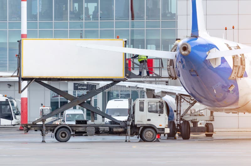 Loading Food on the Plane for Passengers at the Terminal Stock Photo ...