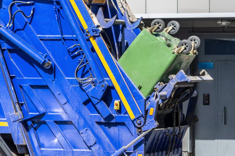 Loading Garbage into a Garbage Truck. Stock Photo - Image of plastic ...