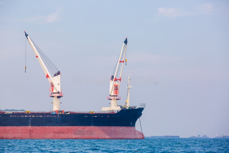 Loading Goods on Cargo Ship with Crane. Shipment from a Merchant To a ...