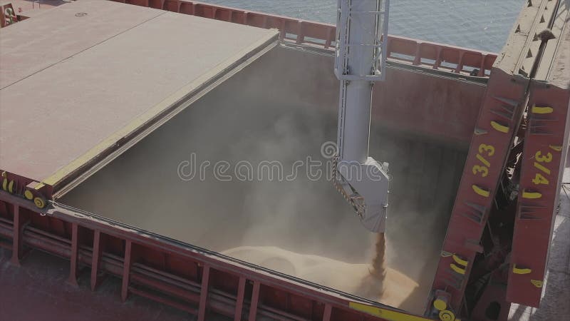 Loading Grain into a Cargo Ship for Transportation by Sea. the Ship is ...