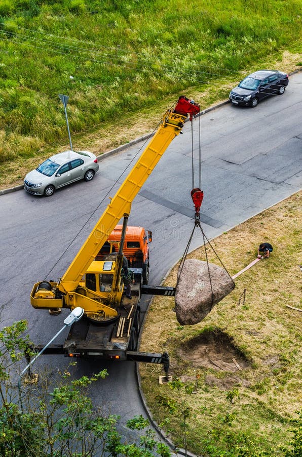 Loading a Granite Boulder Aerial View Stock Photo - Image of mover ...