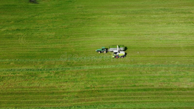 Loading Hay with a Combine into a Tractor Trailer Stock Video - Video ...