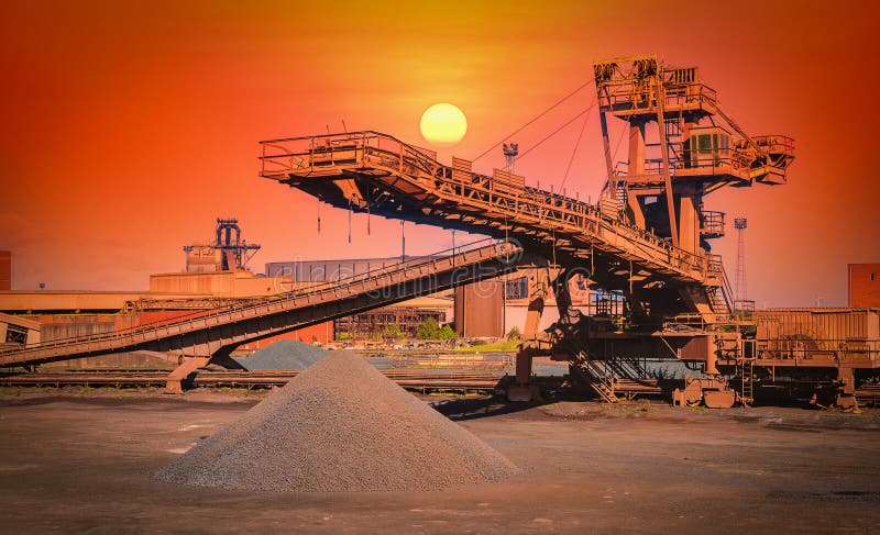 Loading Iron Ore Conveyor Machine in Steel Industry at Sunset Stock ...