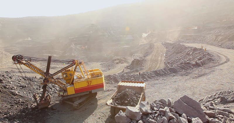 Loading Iron Ore into Mining Excavator. a Large Mining Excavator is ...