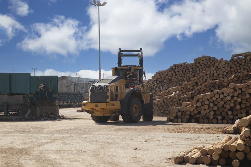 Loading Logs with a Special Loader.Timber Products Warehouse on a ...