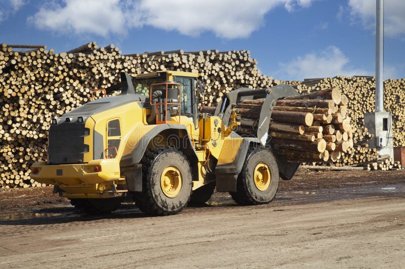 Loading Logs with a Special Loader.Timber Products Warehouse on a ...