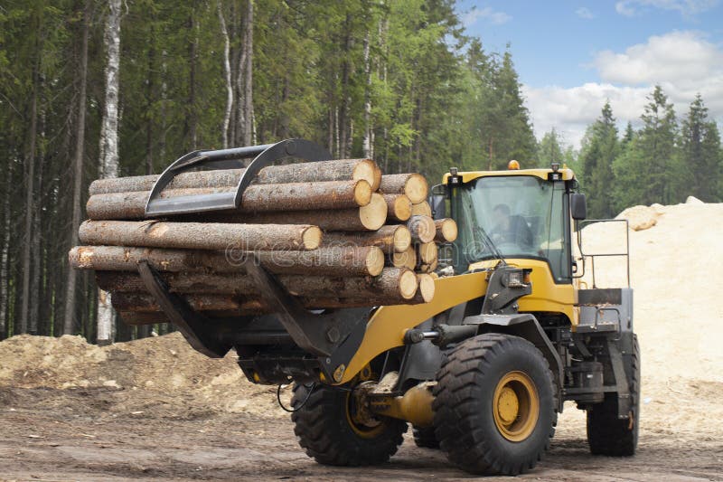 Loading Logs with a Special Loader.Timber Products Warehouse on a ...