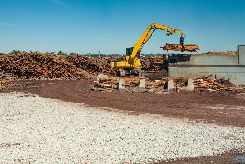 Loading logs using crane stock image. Image of logging - 78649361