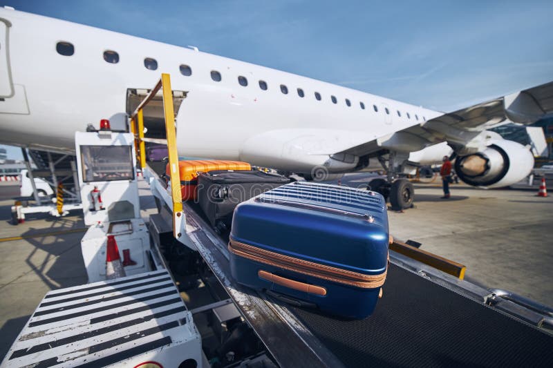 Loading of Luggage To Airplane Stock Photo - Image of loading, handling ...