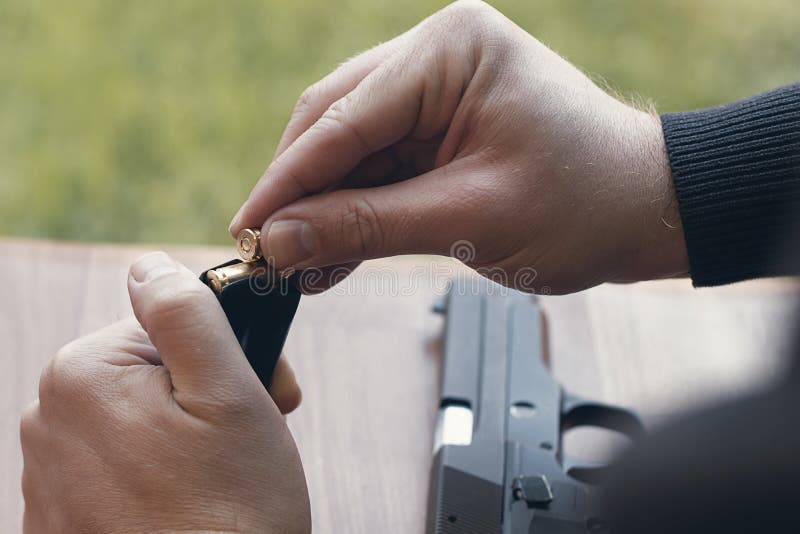 Loading a Magazine. Loading Gun Stock Photo - Image of criminal, hand ...
