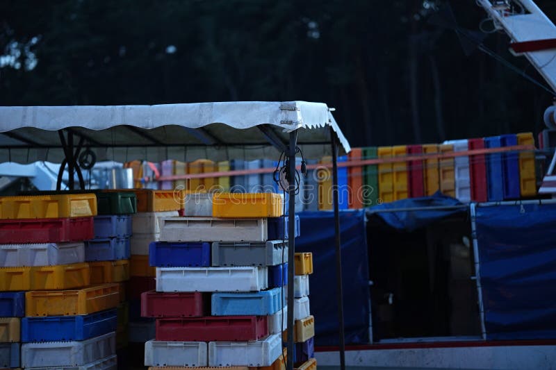 Loading of Many Plastic Containers on a Ship in the Seaport Stock Image ...