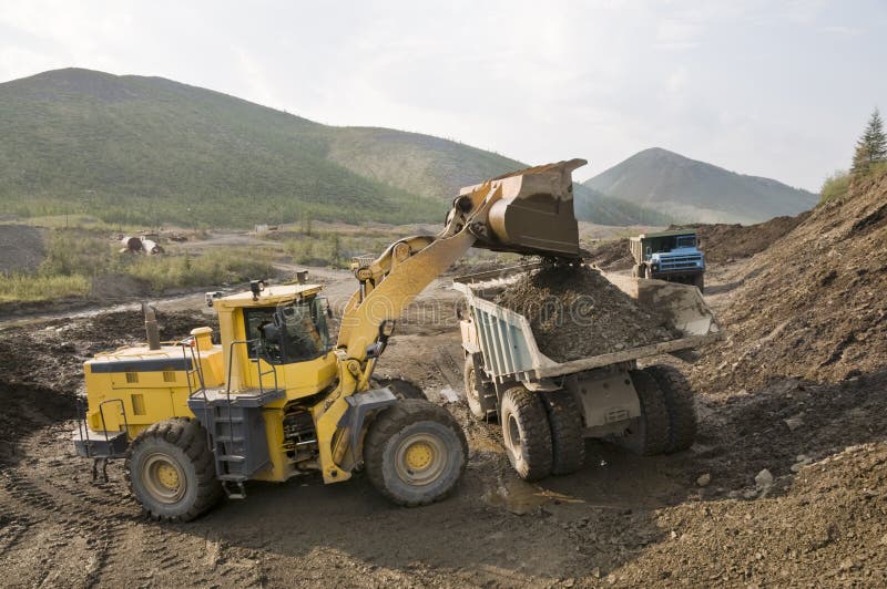 Loading of Mountain Soil into the Body of a Dump Truck Using a Wheel ...