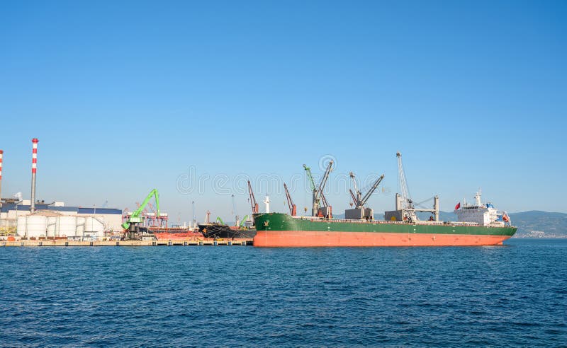 Loading Onto Bulk Carrier Ship at Commercial Port on a Sunny Day Stock ...