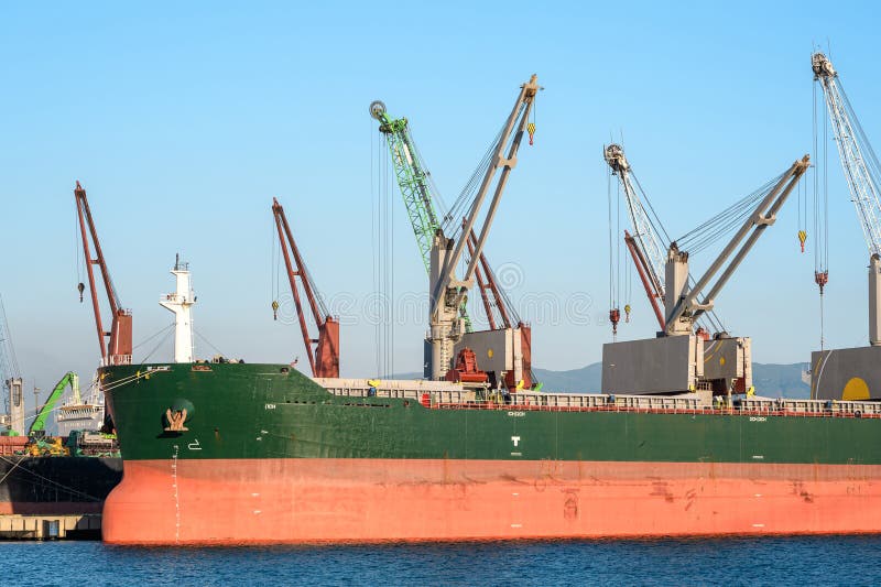 Loading Onto Bulk Carrier Ship at Commercial Port on a Sunny Day Stock ...