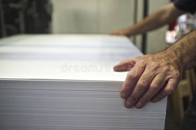 Loading of paper operation stock image. Image of book - 50424219