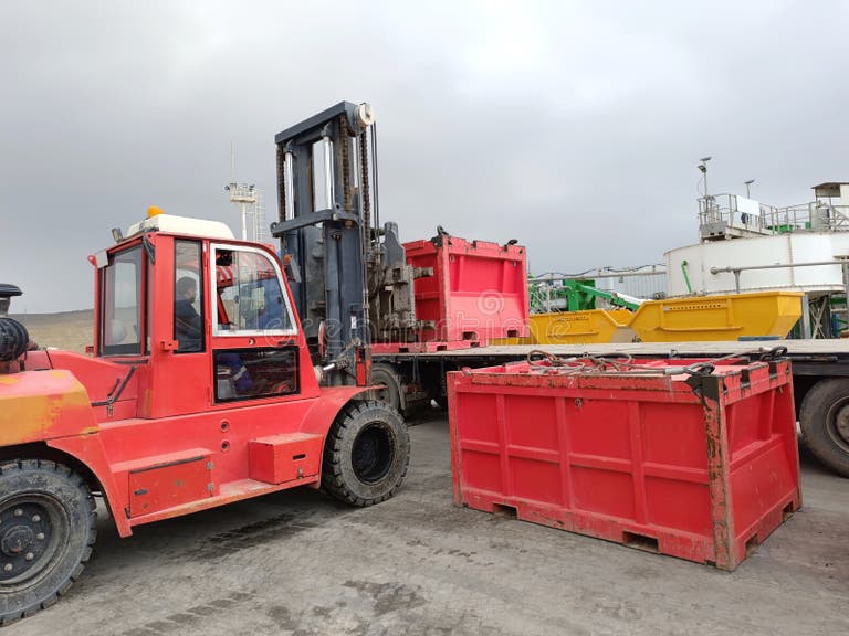 Loading Red Containers Full of Beft Waste Onto a Truck Using a Forklift ...