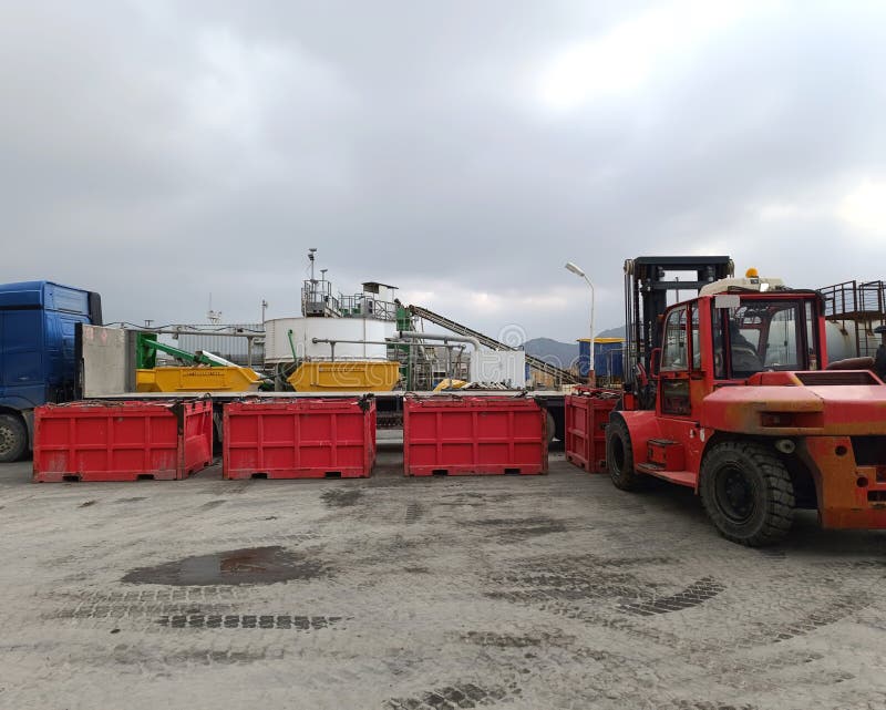 Loading Red Containers Full of Beft Waste Onto a Truck Using a Forklift ...