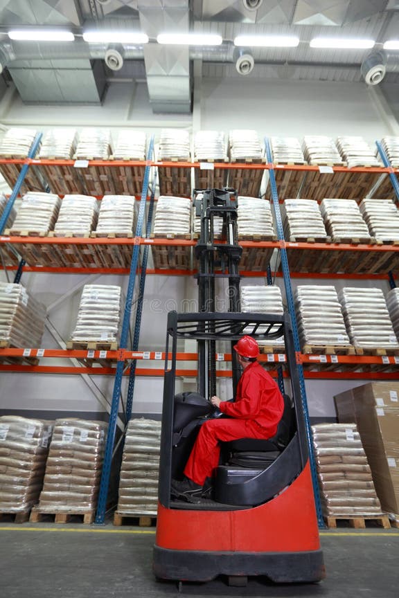 Loading Sacks with Forklift Loader in Warehouse Stock Photo - Image of ...