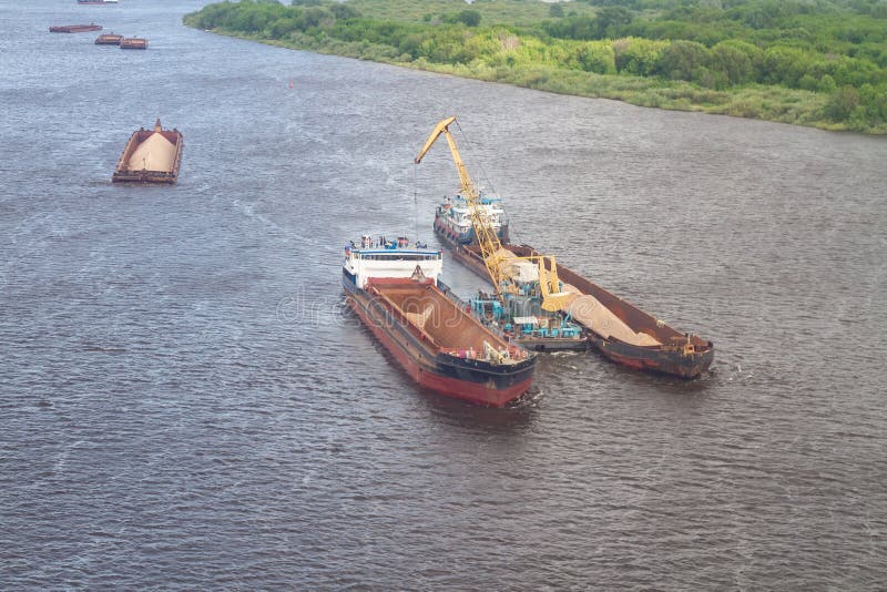 Loading Sand into a Barge on the River, Transporting Cargo by Water ...