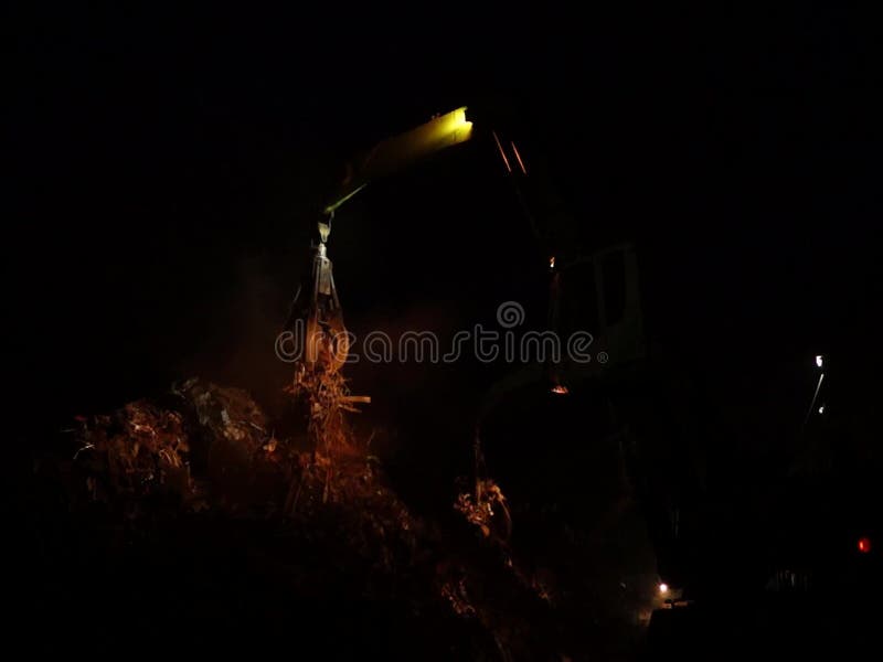 Loading Scrap Metal by a Large Manipulator at Night. Stock Footage ...
